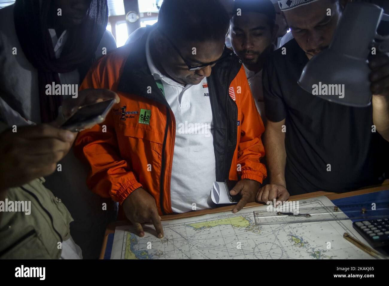 Abdul Azeez Rahim with other Captain look at map inside the Nautical ...