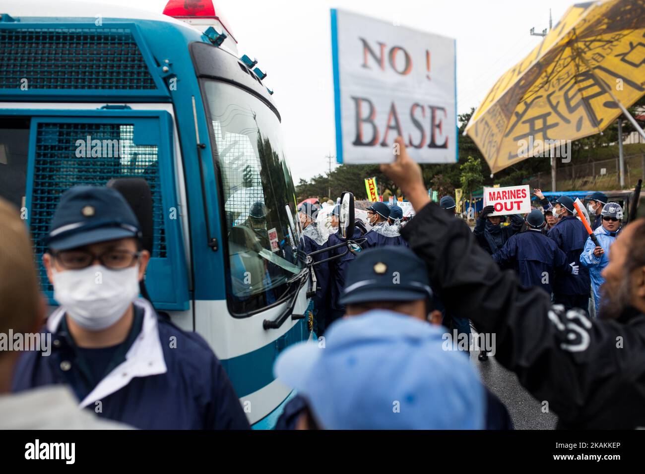 Anti U.S. Base protesters shout with their placards in front of the U.S ...