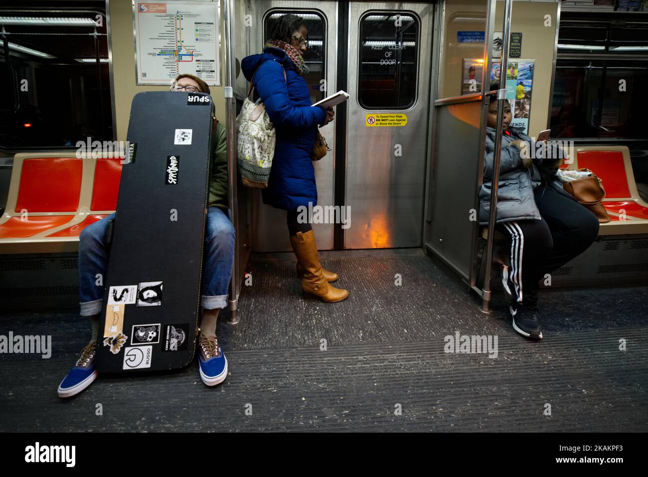 Commuters are seen onboard of a SouthEastern Pennsylvania ...