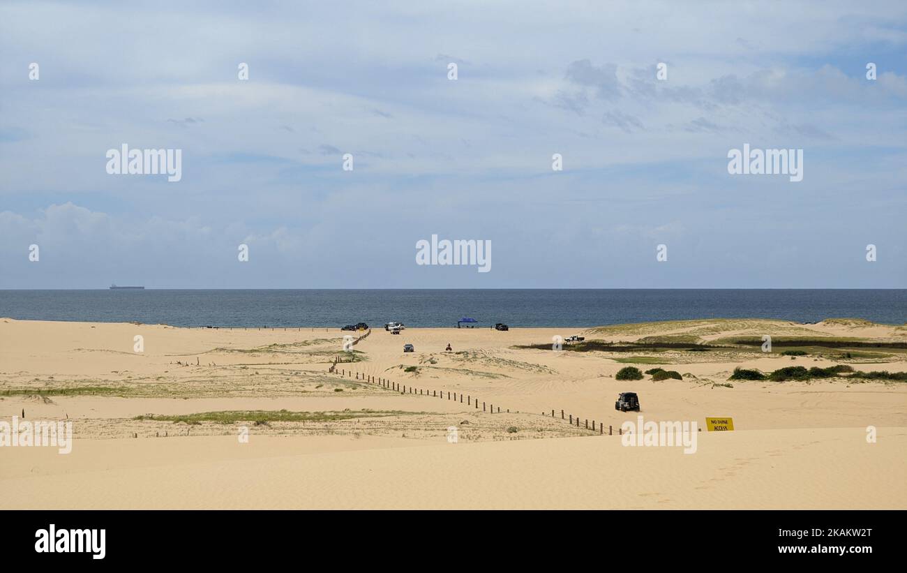 A scenic view of the sandy beach and the ocean Stock Photo - Alamy