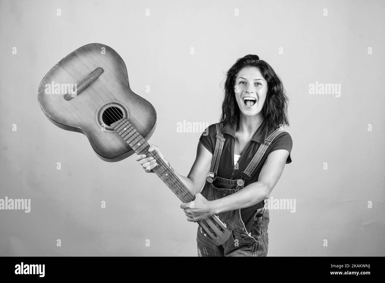 music is life. woman with acoustic instrument. have fun on party ...