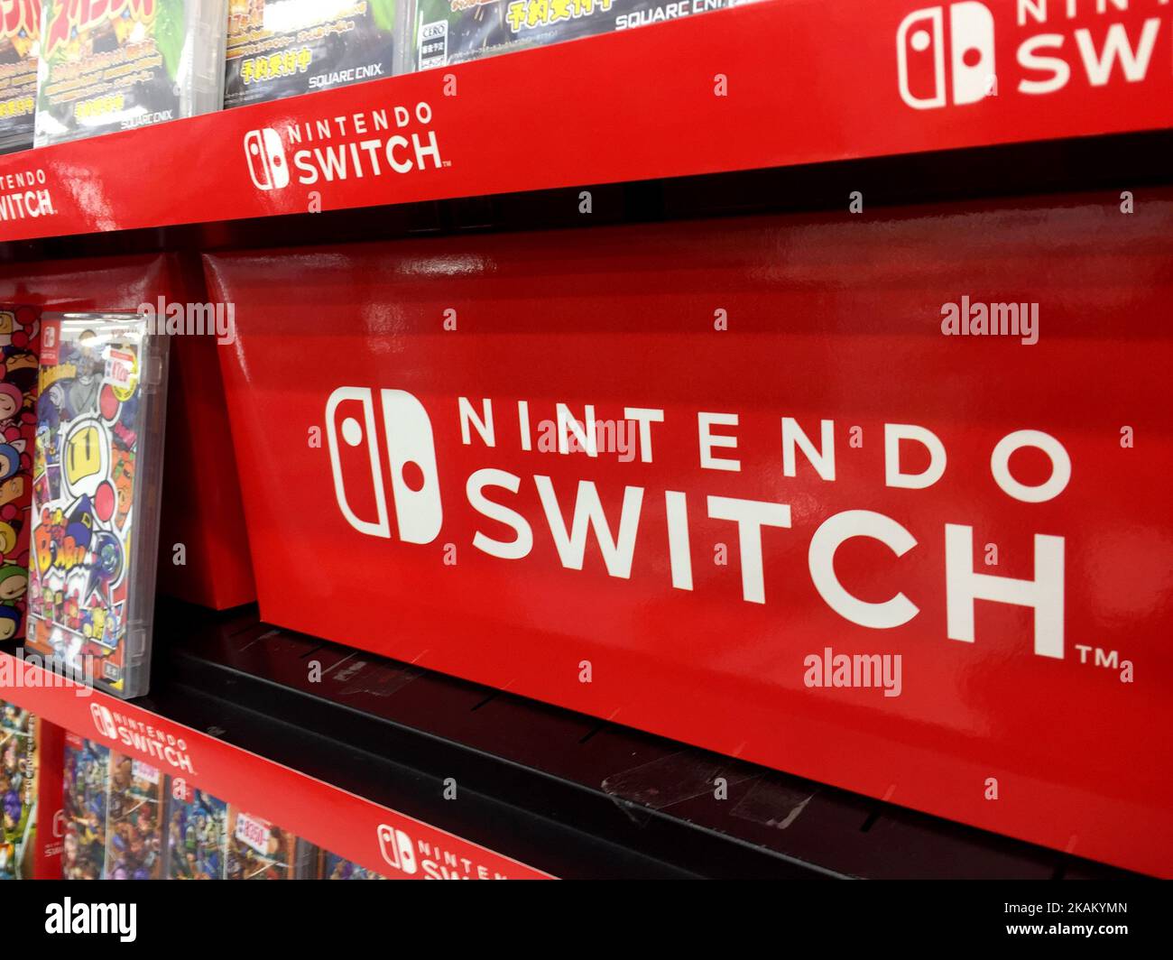 Logos of Nintendo Switch game console are seen at an electronics store ...