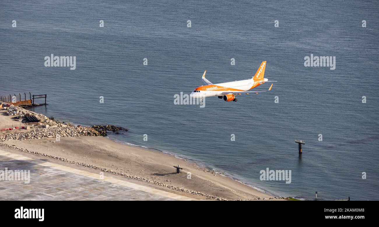 EasyJet Airplane landing to the airport during sunny morning. Aerial ...