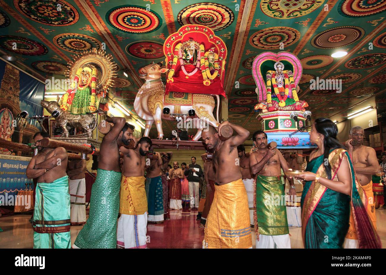 Tamil Hindu devotees take part in the religious procession as they ...