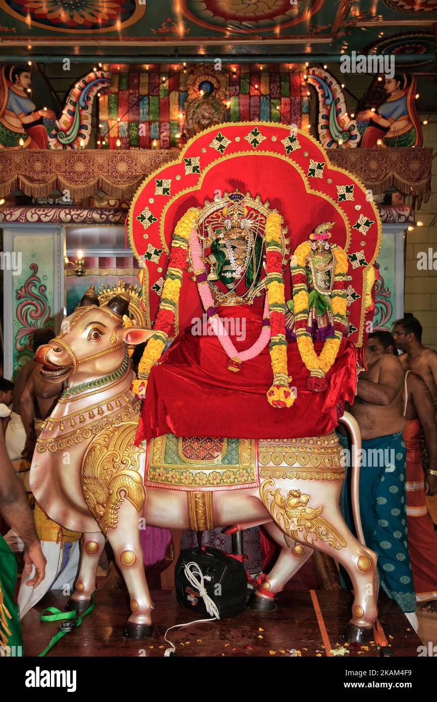 The idol of Lord Shiva atop the bull Nandi before a religious ...