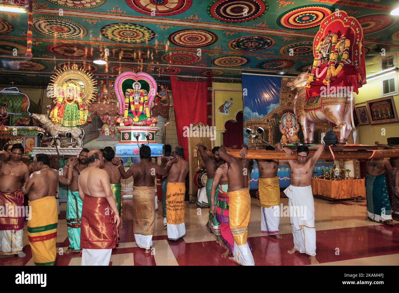 Tamil Hindu devotees take part in the religious procession as they ...