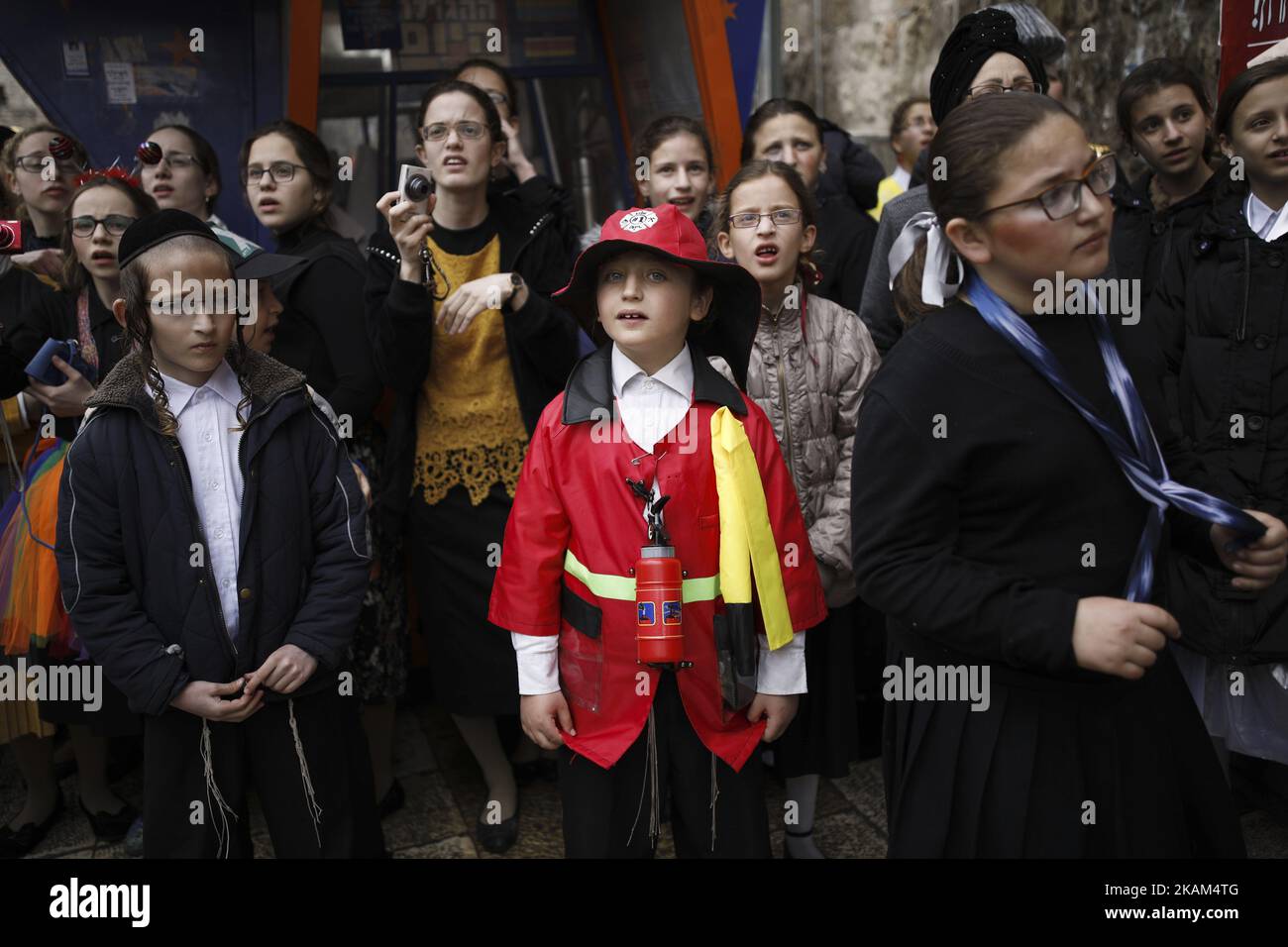 Ultra-Orthodox Jewish children wearing costumes during the Jewish ...