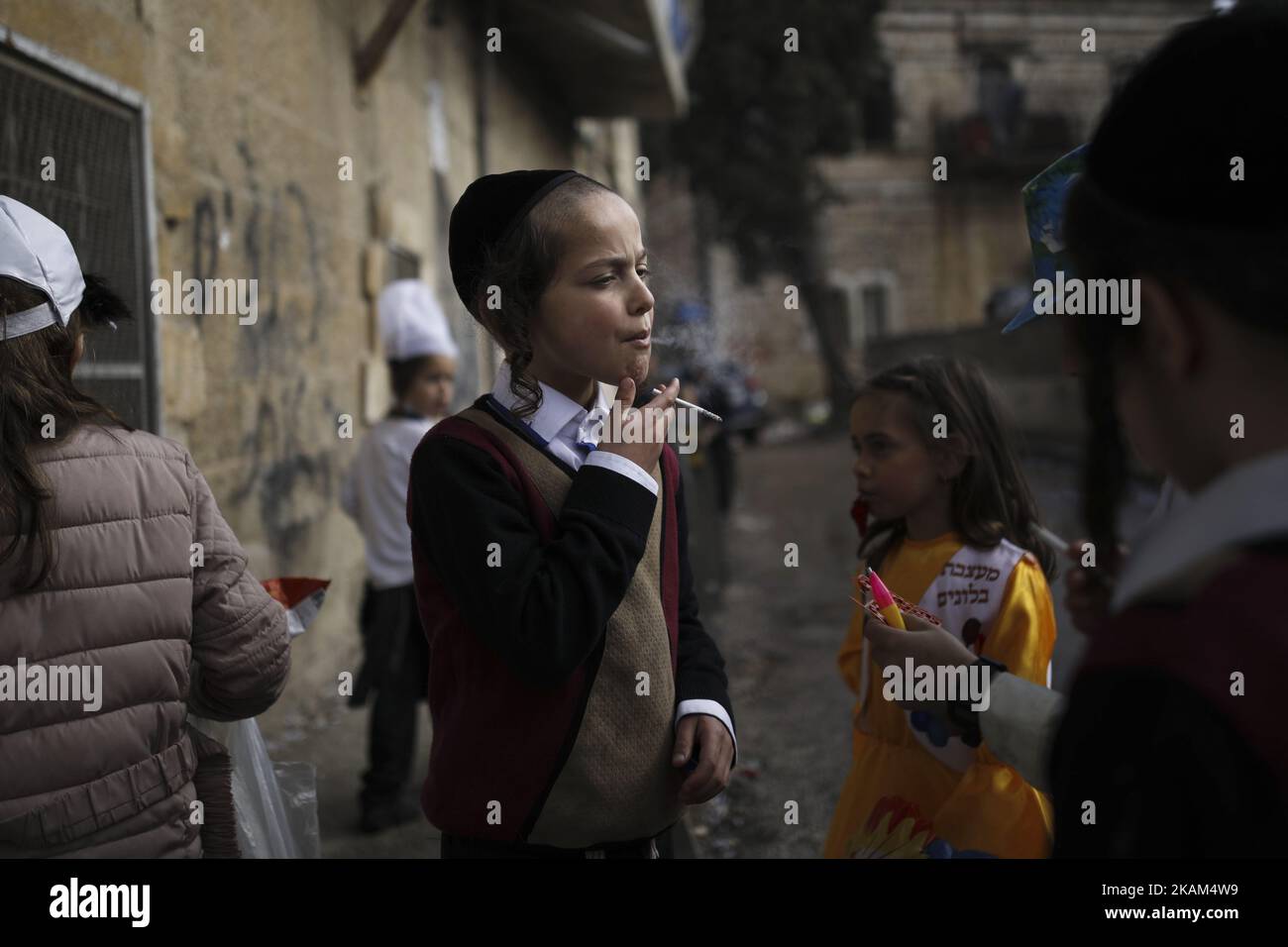 An Ultra-Orthodox Jewish child is seen smoking a cigarette during the ...