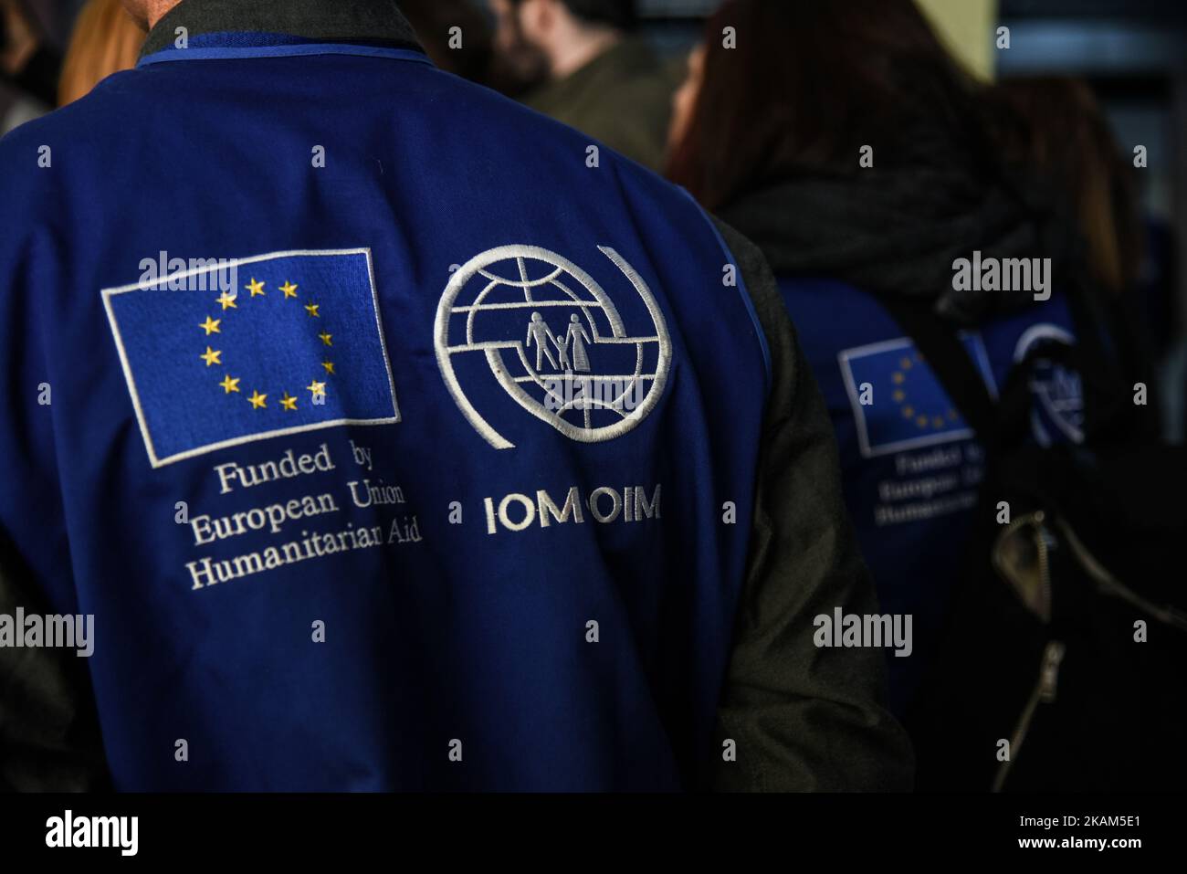 Volunteers of International Organization for Migration attend open a ...