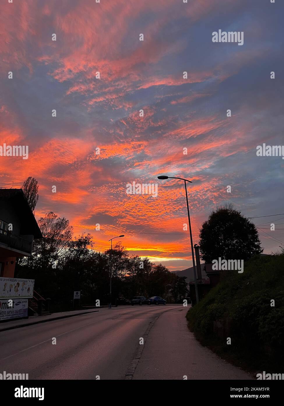 A street of a small town at sunset, vertical Stock Photo - Alamy