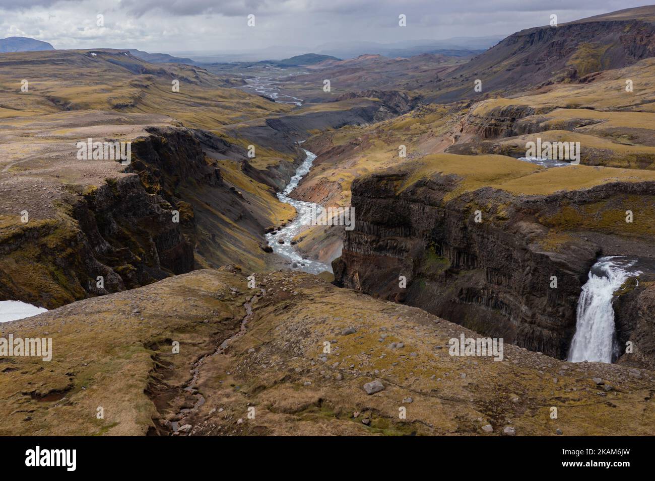 An aerial drone shot of the scenic Haifoss waterfall and the river ...