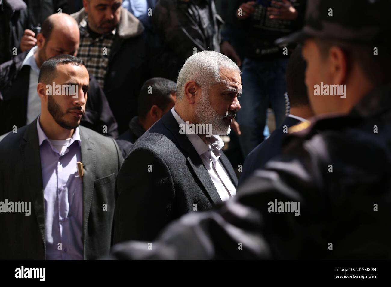 Senior Hamas leader Ismail Haniya (C) leaves a hospital morgue in Gaza ...