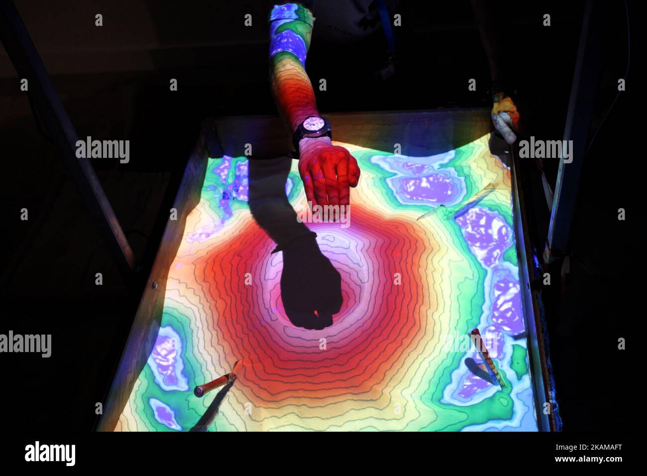 Augmented reality sandbox allows users to create topography models by ...