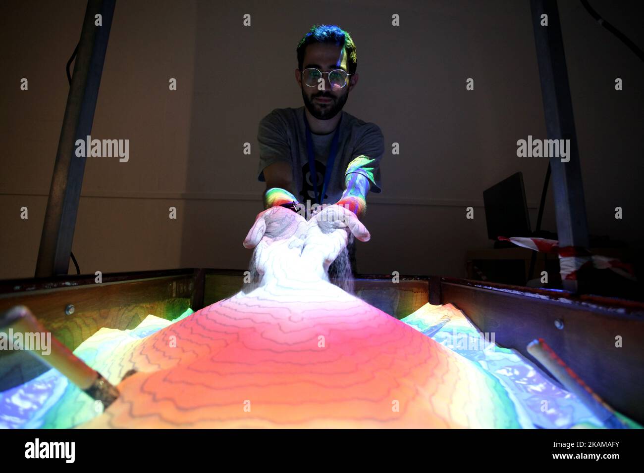 Augmented reality sandbox allows users to create topography models by ...