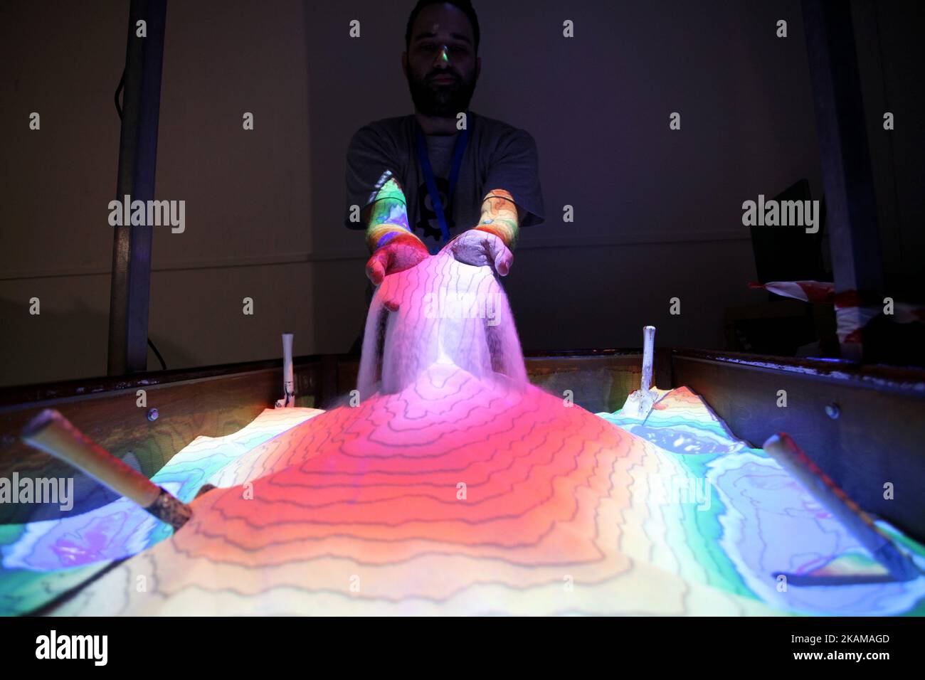 Augmented reality sandbox allows users to create topography models by ...