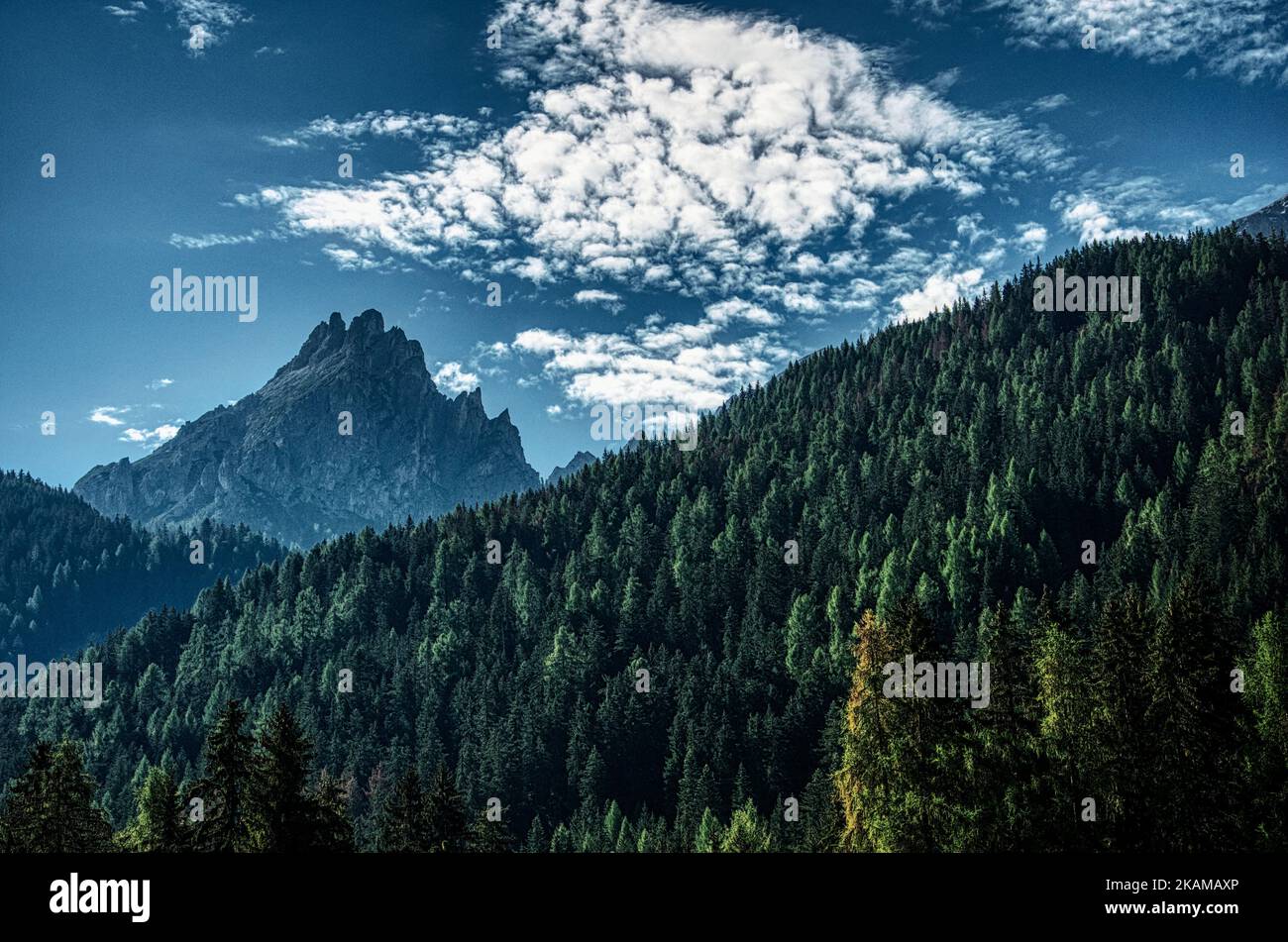The peaks of Mount Pollice, 2259 meters, rise into the sky above the ...