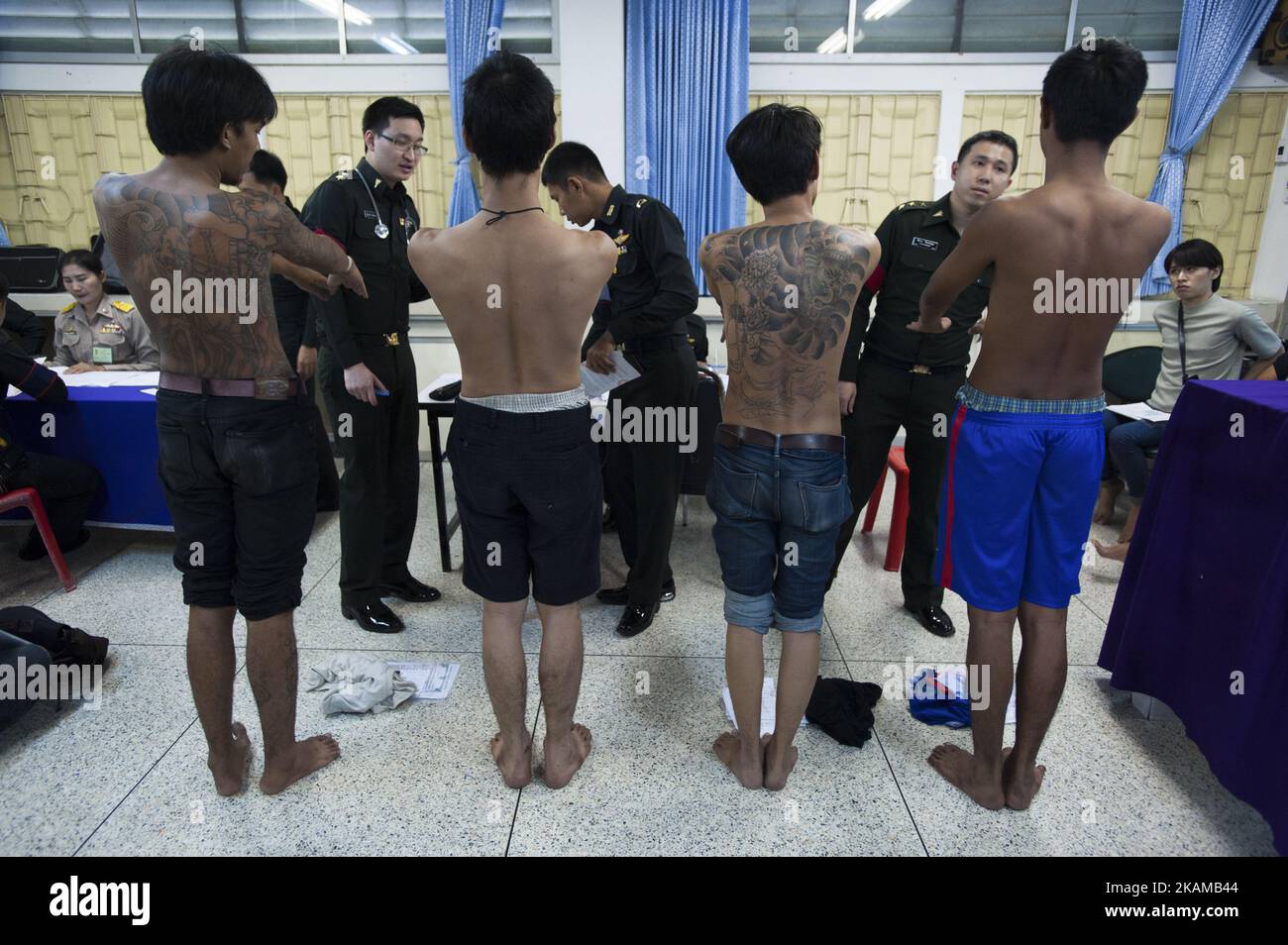 Thai army personnel give a physical check-up to a Thai man during a ...