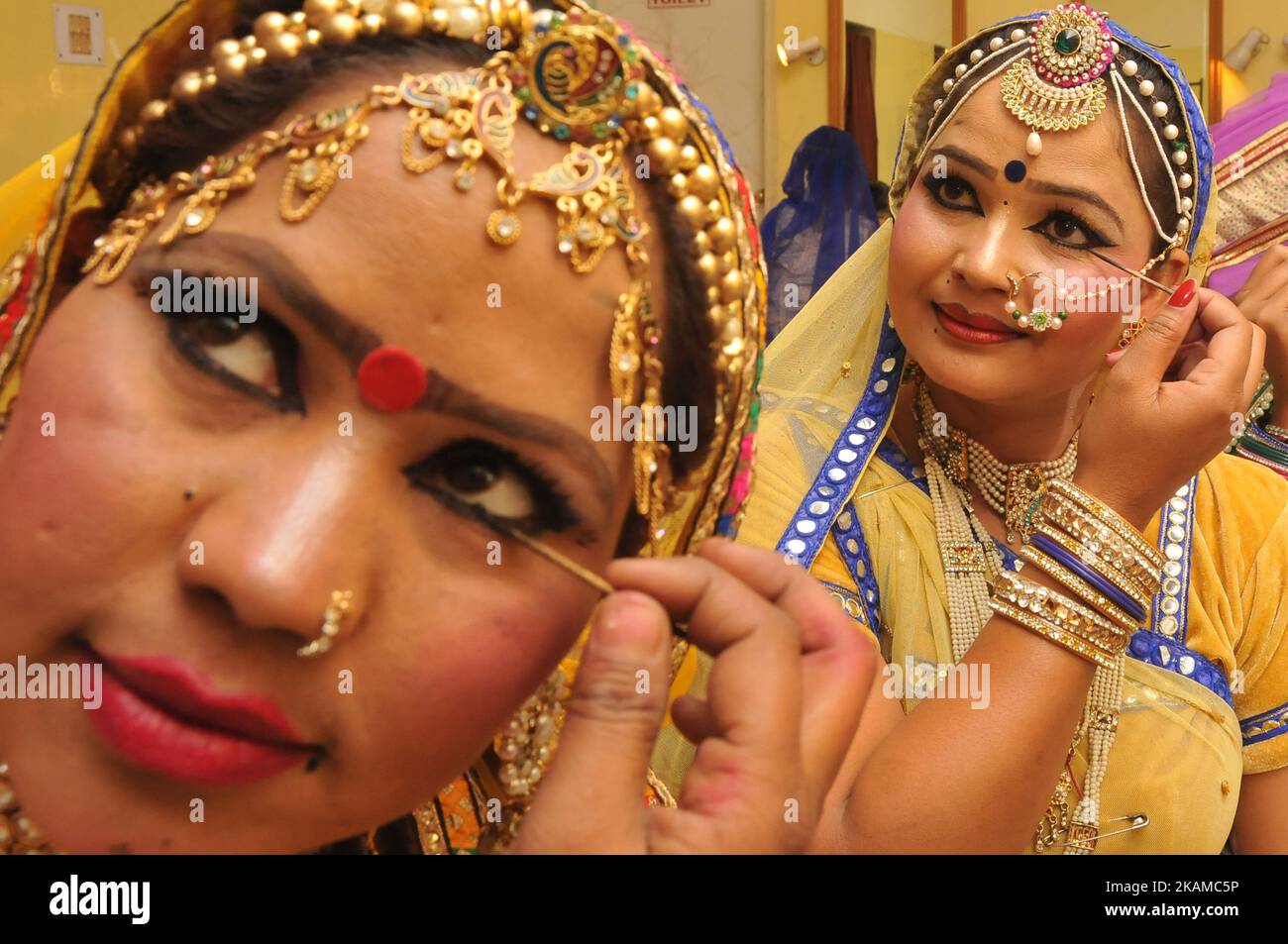 Indian Folk Dancer makeup at Green Room before performing Indian folk ...