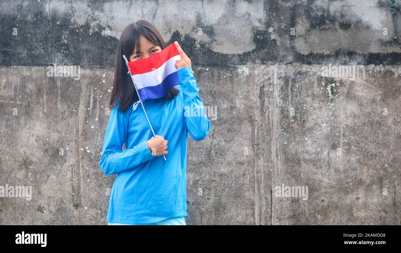 a little girl with a dutch flag Stock Photo - Alamy