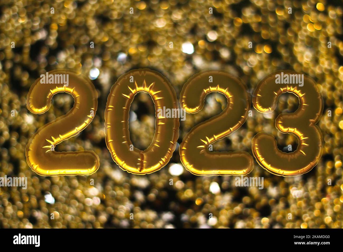 Gold inflatable foil balloons numbers 2023 on the window against the background of the night ...