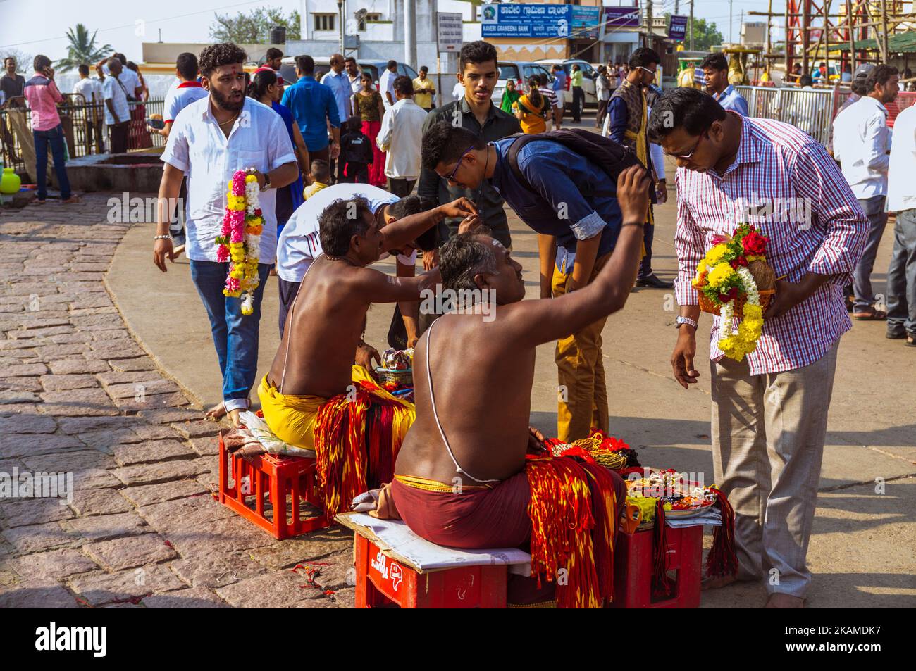 Chamundi Hill, Mysore, Karnataka, India : A brahmin priest puts a bindi ...