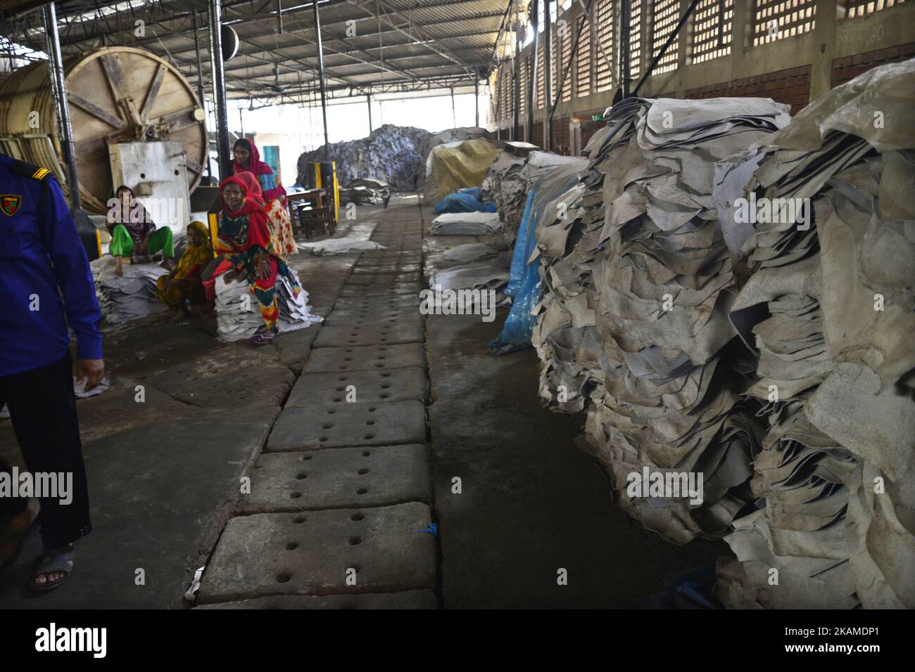Bangladeshi workers rest at a tannery in Dhaka on April 8, 2017. A ...