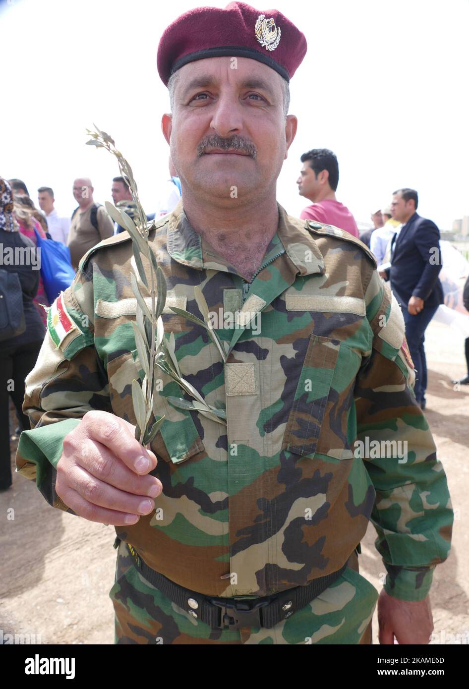 Peshmerga join a Peace Solidarity March on Palm Sunday with the Chaldean Christian church ...