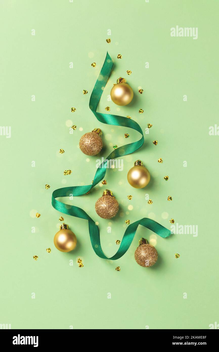 Christmas card with golden glitter balls decorations and satin ribbon ...