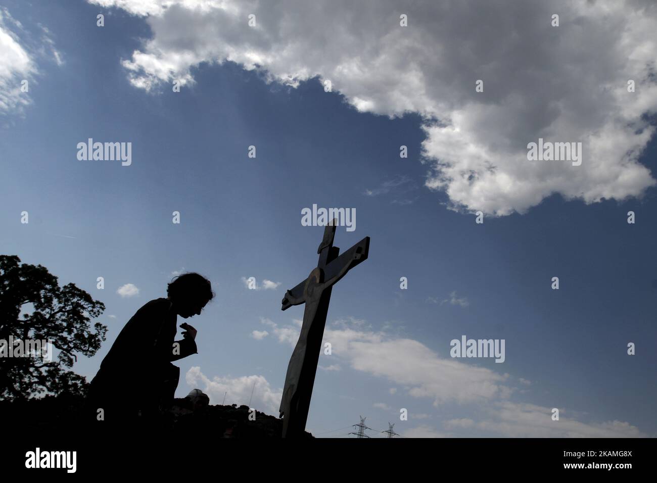 A woman worships the Crucifix during the Apokathilosis, a reenactment ...