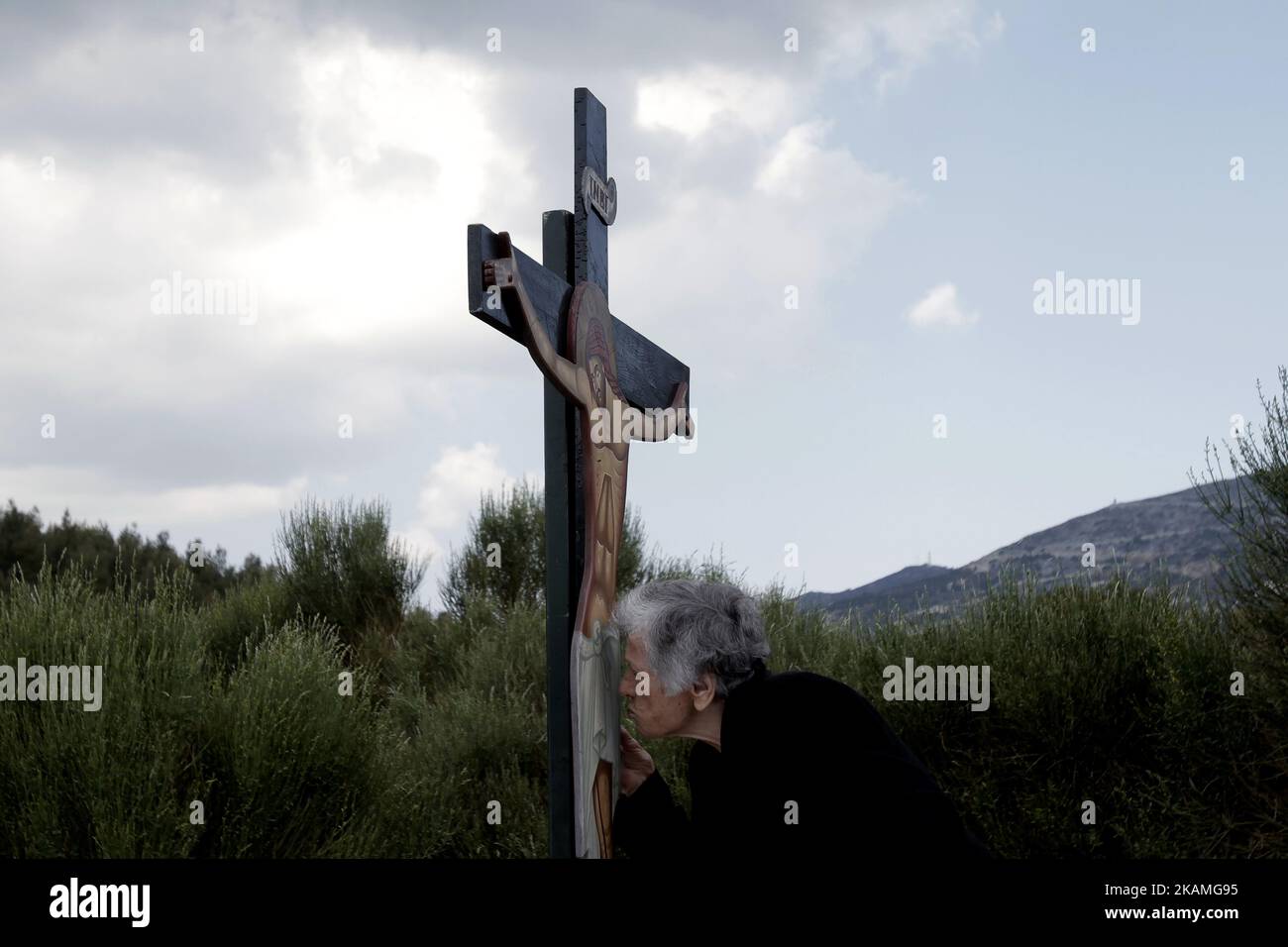 A woman worships the Crucifix during the Apokathilosis, a reenactment ...