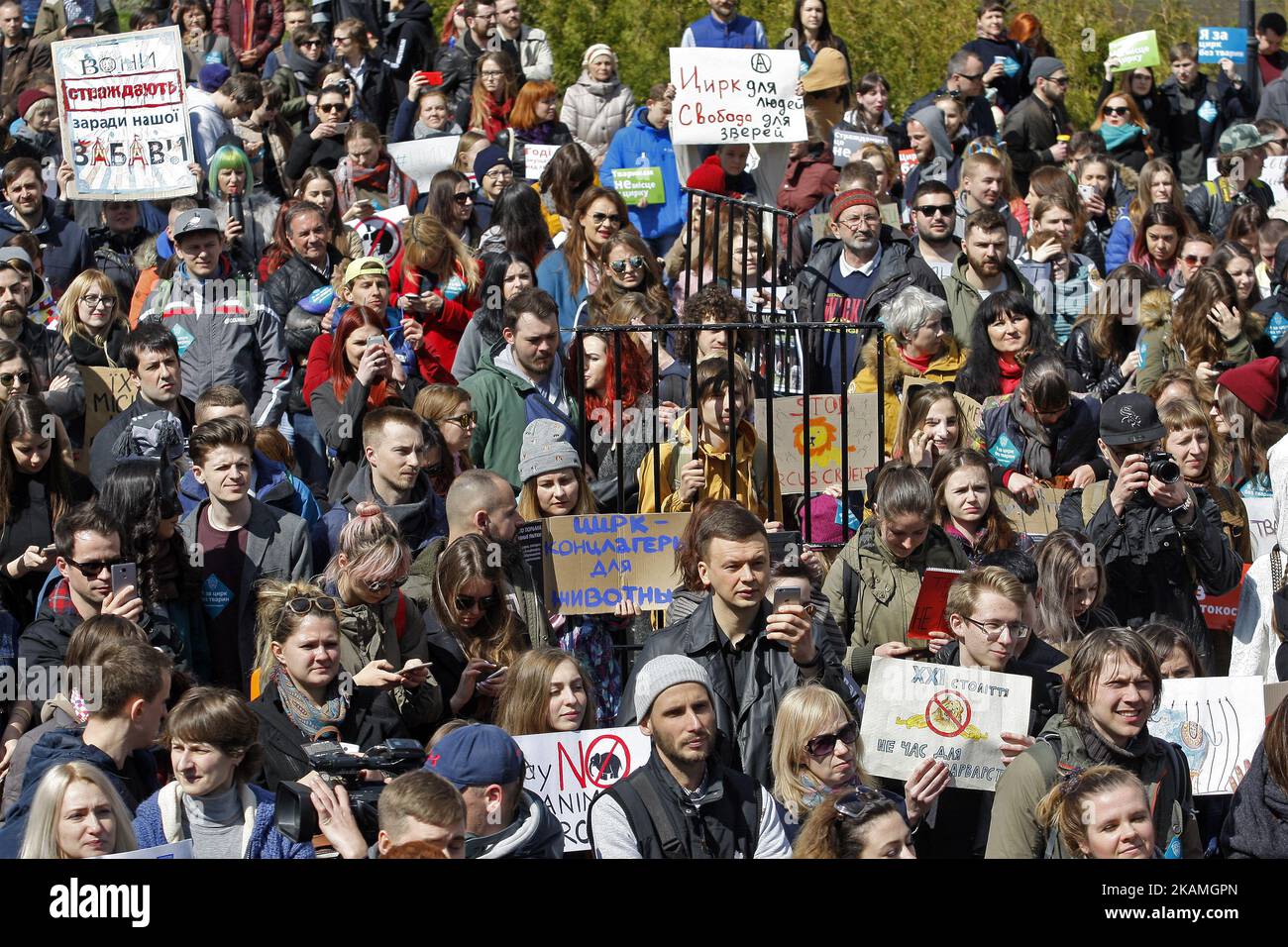 Ukrainian activists hold posters, as they protest against the use of ...