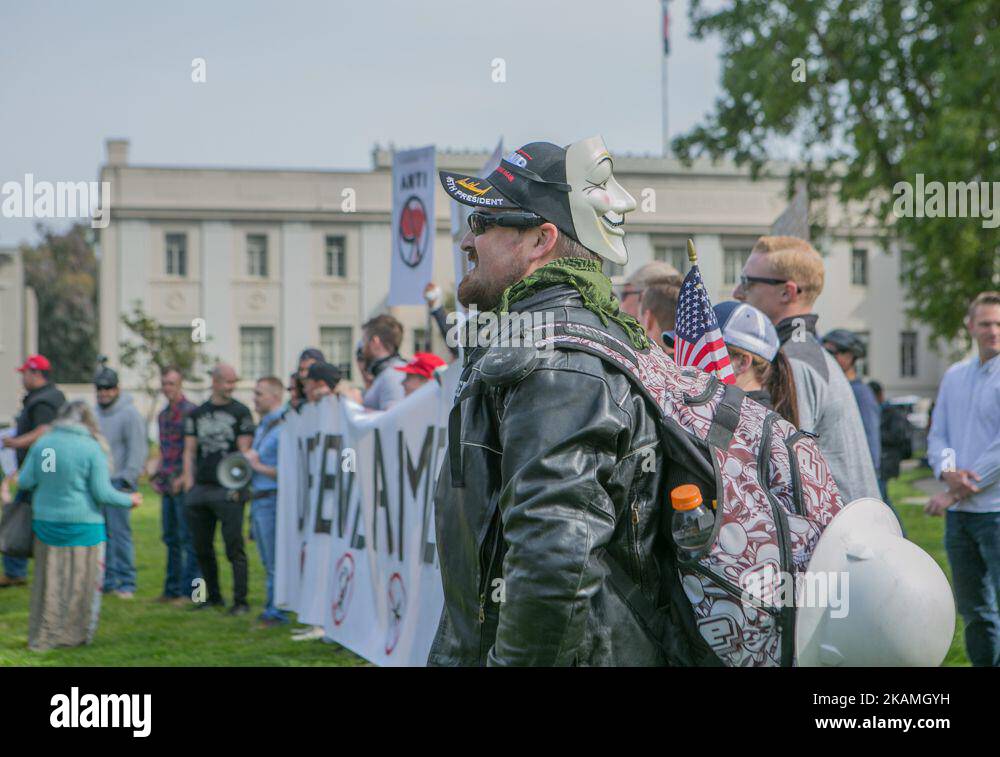 A Trump supporter wears a Guy Fawkes mask during a free speech rally at ...