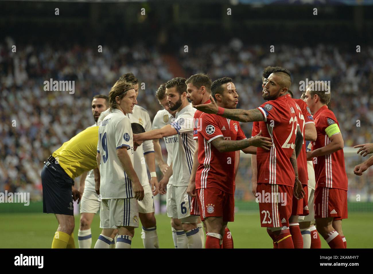 Arturo Vidal (R) reats during the UEFA Champions League Quarter Final ...