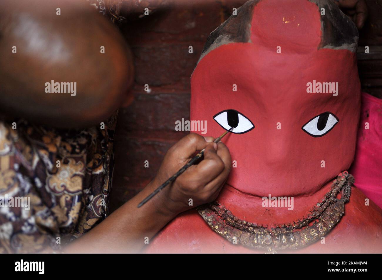 GHAMBIR NEKHU, 46 yrs old, priest painting on Statue of Idol Rato ...