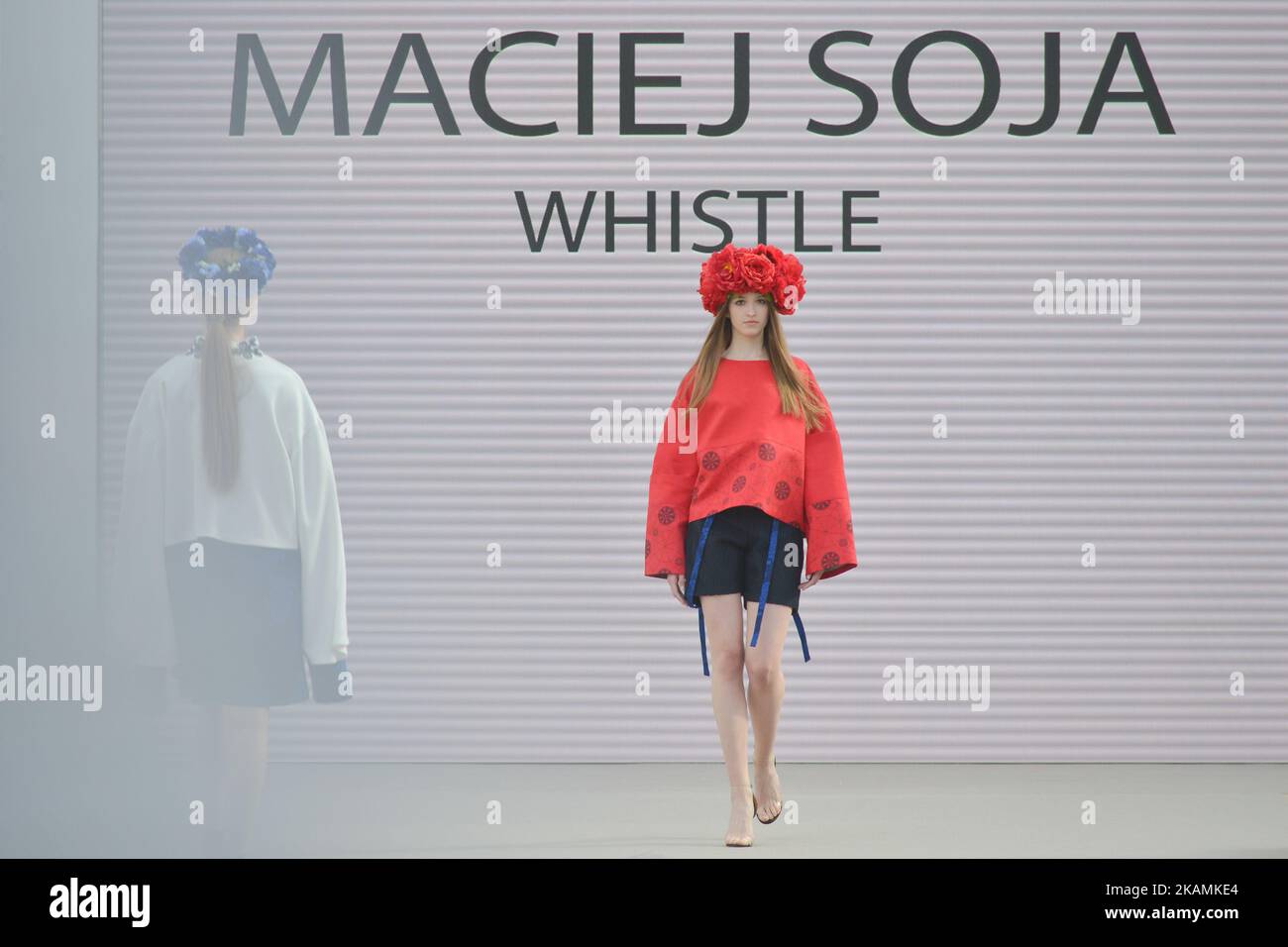 A model showcases a creation by a young Polish fashion designer Maciej ...