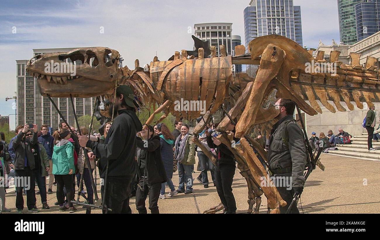 People display a T-Rex skeleton puppet during the March for Science at ...