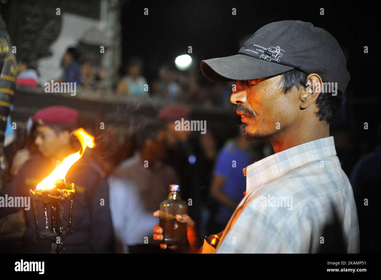 Devotee carrying oil lamp on a first day of festival commencement at ...
