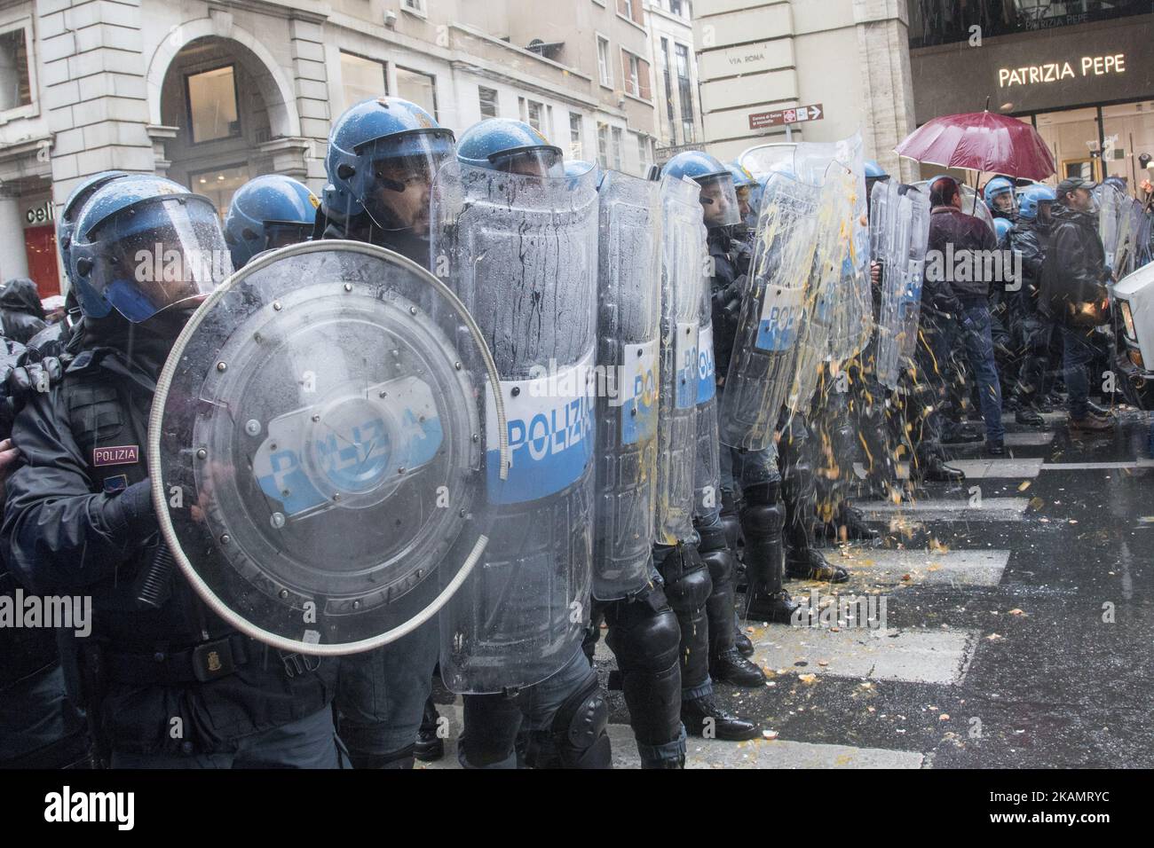 Italian riot police officers stand guard after receiving some eggs on ...