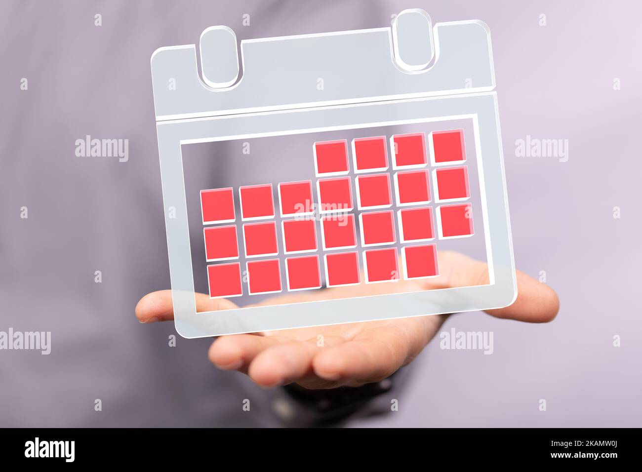 A 3D-rendered calendar floating above a person's hand Stock Photo - Alamy