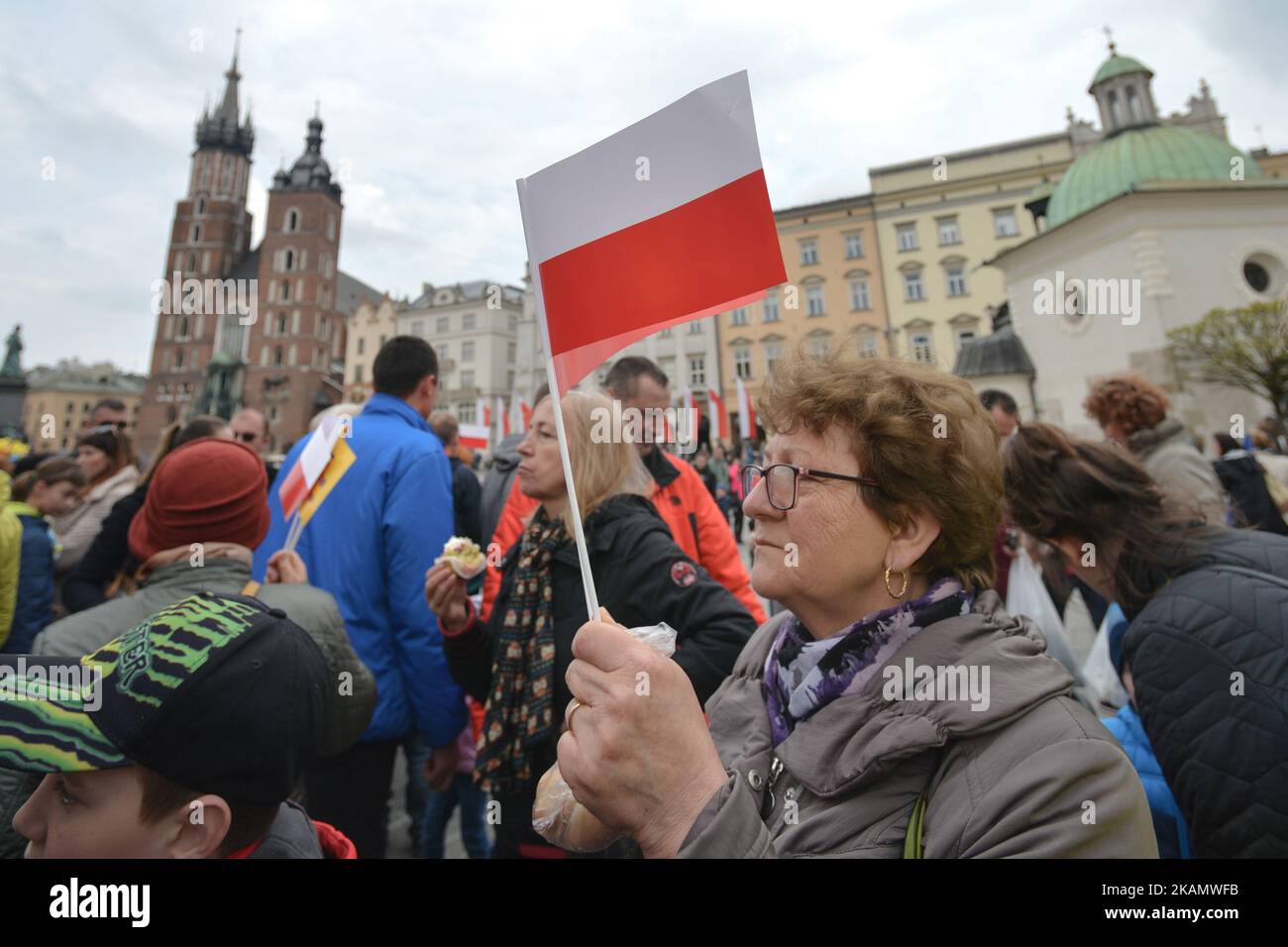 A lady carrying a Polish flag on Poland's Flag Day. Flag Day was ...
