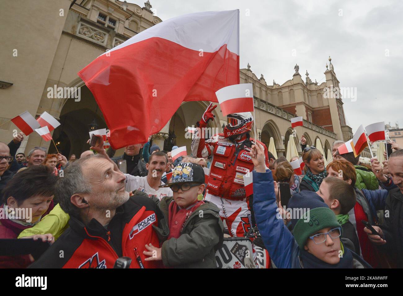 Rafal Sonik, a Polish quad rally driver, carries the Polish national ...
