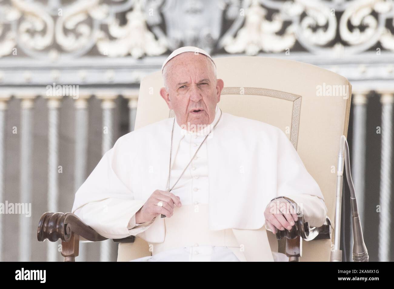 Pope Francis delivers his blessing as he arrives for his general ...