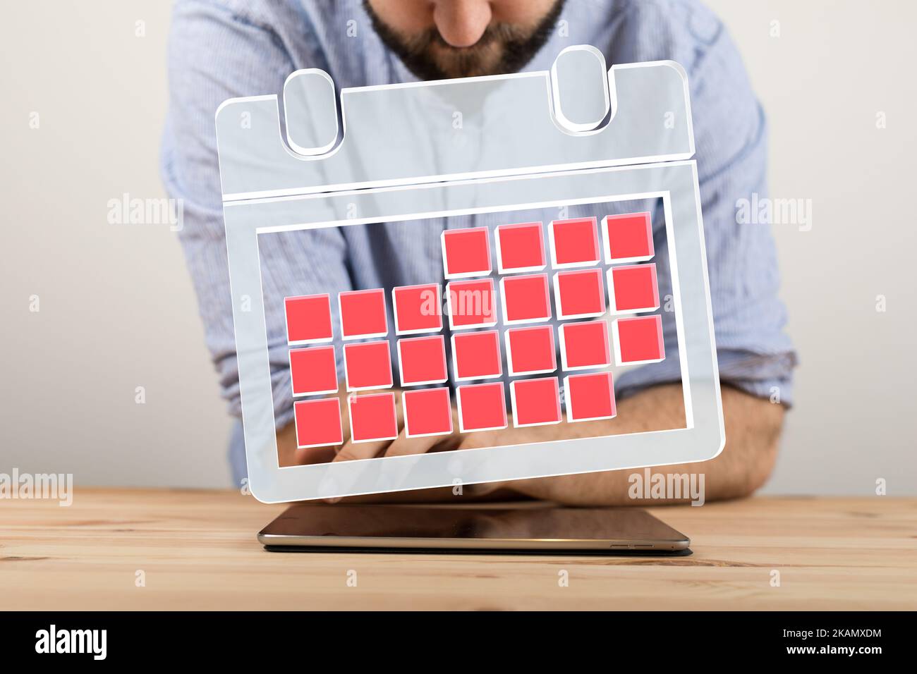 A 3D-rendered calendar floating above a person's tablet Stock Photo - Alamy