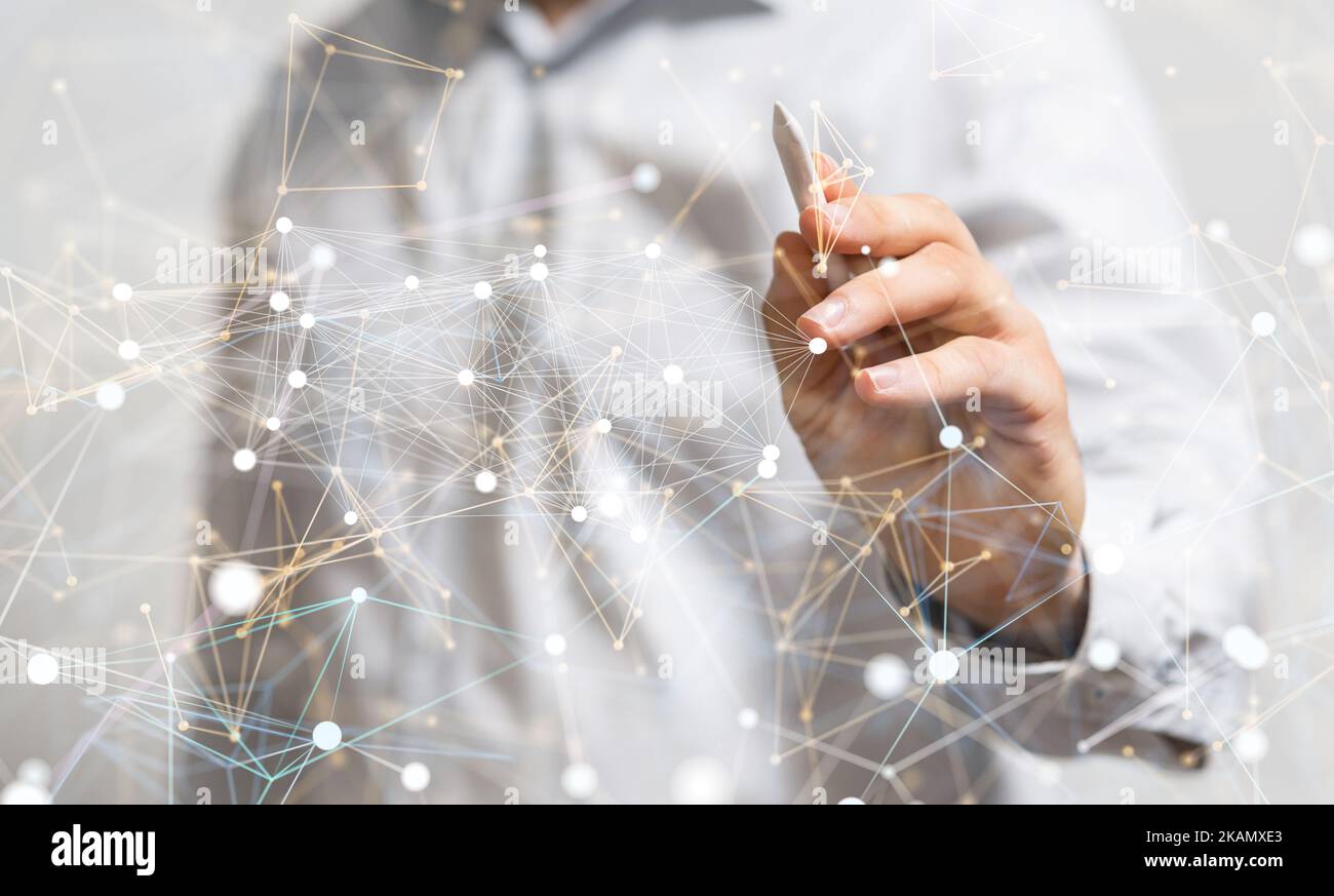 A hand pointing with a pencil at an illustrative big data and ...