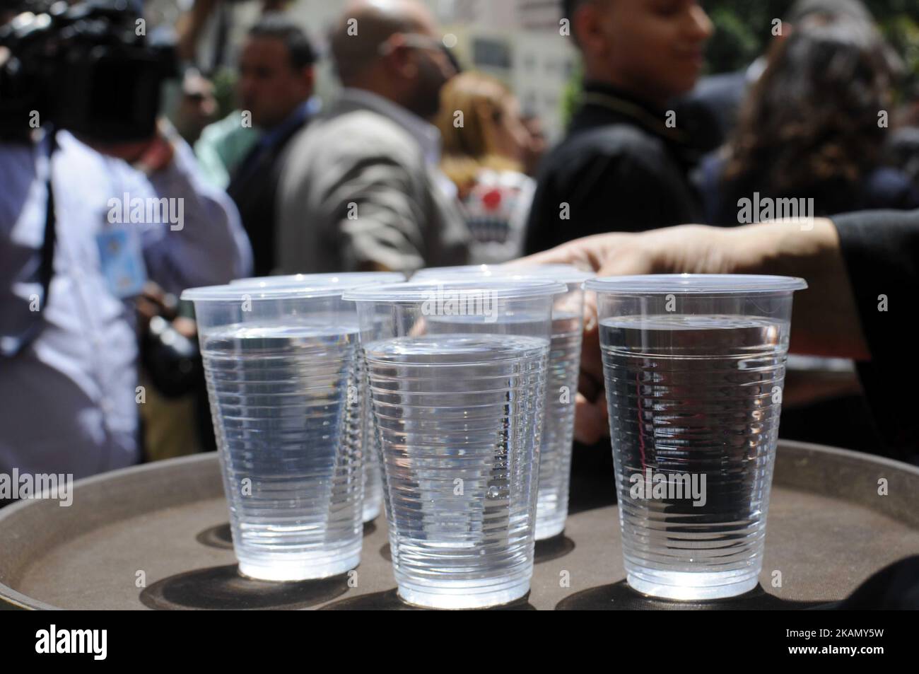 Arab League representatives and officials drink water, as a symbolic ...