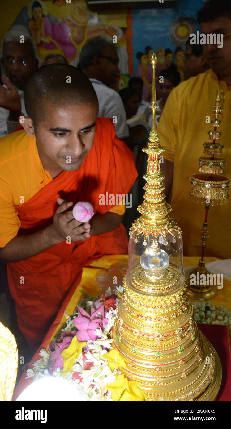 An Indian Buddhist monk looks at a newly inaugurated 'Relic Casket' of ...