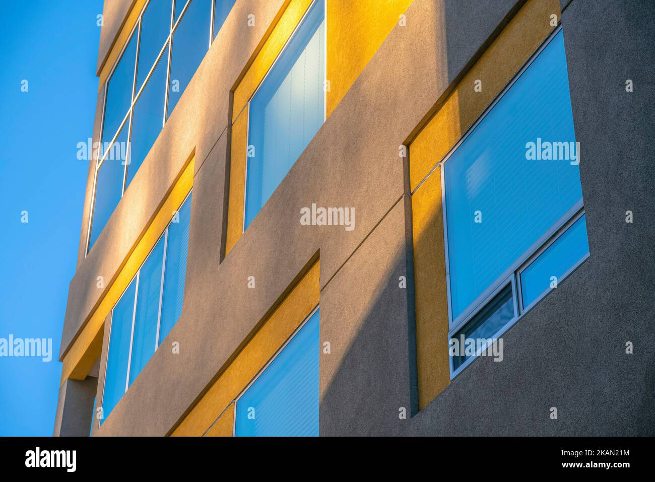 Modern apartment building exterior with picture windows at downtown ...