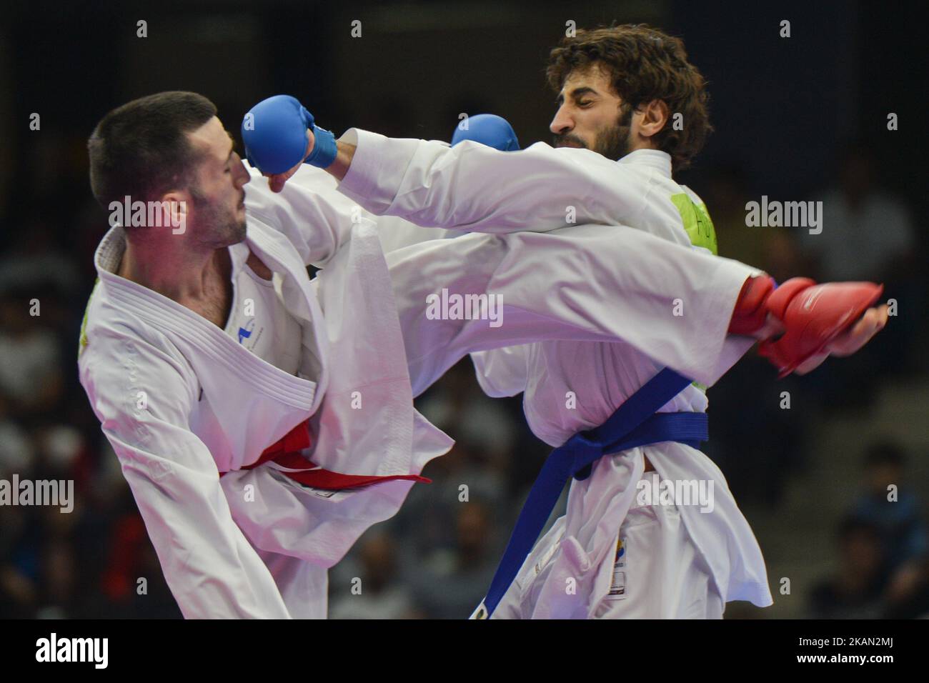 Amir Mahdi Zadeh (Red) of Iran and Emad Almalki (Blue) of Saudi Arabia ...