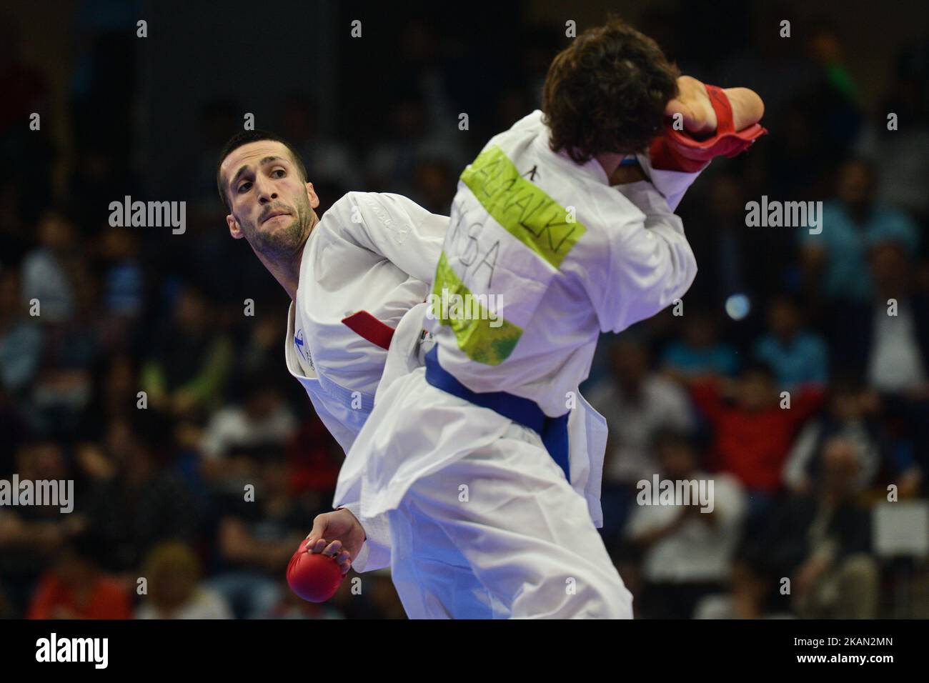 Amir Mahdi Zadeh (Red) of Iran and Emad Almalki (Blue) of Saudi Arabia ...
