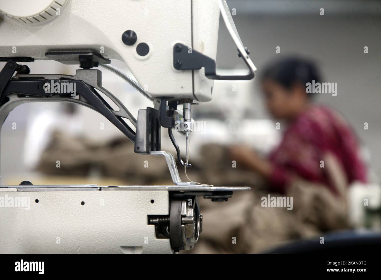 Garments worker working inside a factory in Gazipur in Bangladesh, on ...
